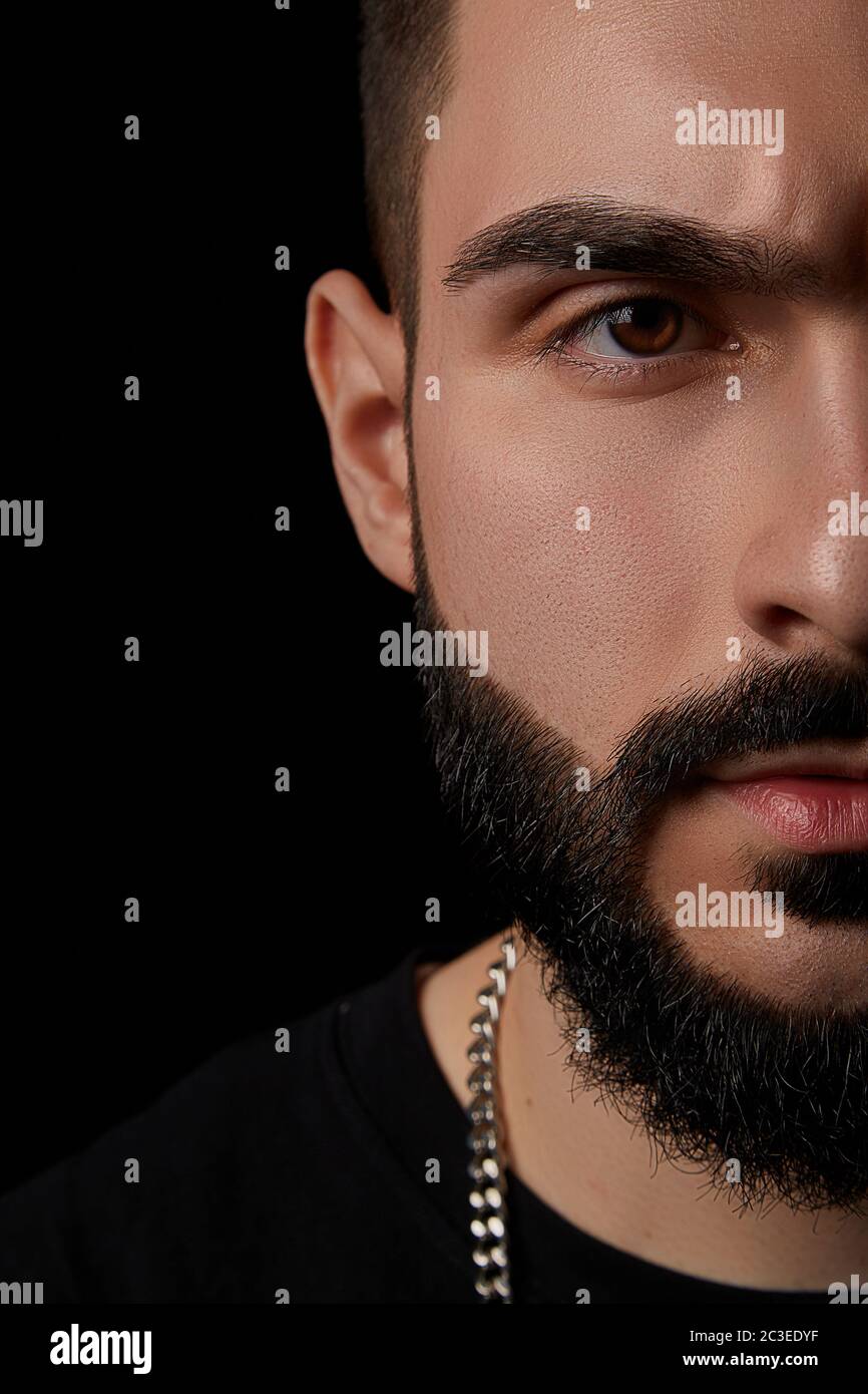 a close-up dramatic portrait of a young serious guy Stock Photo - Alamy