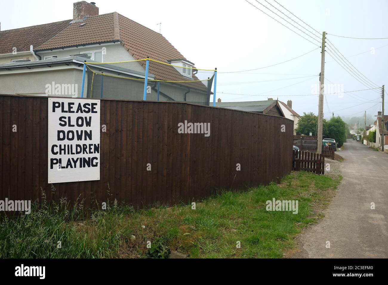 Slow down village road sign hi-res stock photography and images - Alamy