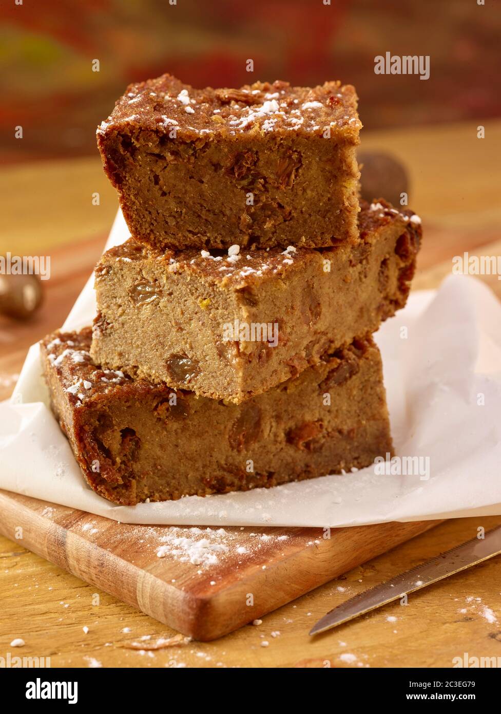 Sliced Bread Pudding on greaseproof paper waiting to be wrapped as a ...