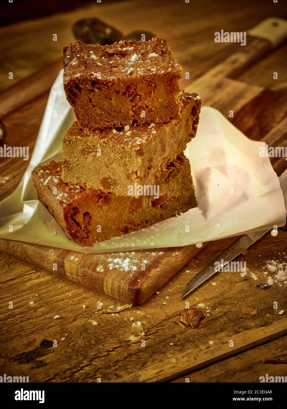 Sliced Bread Pudding on greaseproof paper waiting to be wrapped as a ...