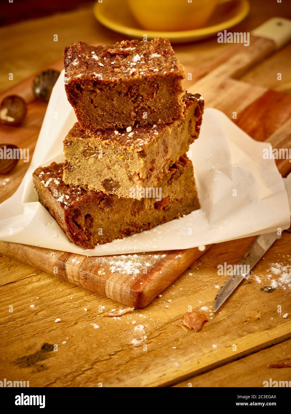 Sliced Bread Pudding on greaseproof paper waiting to be wrapped as a ...
