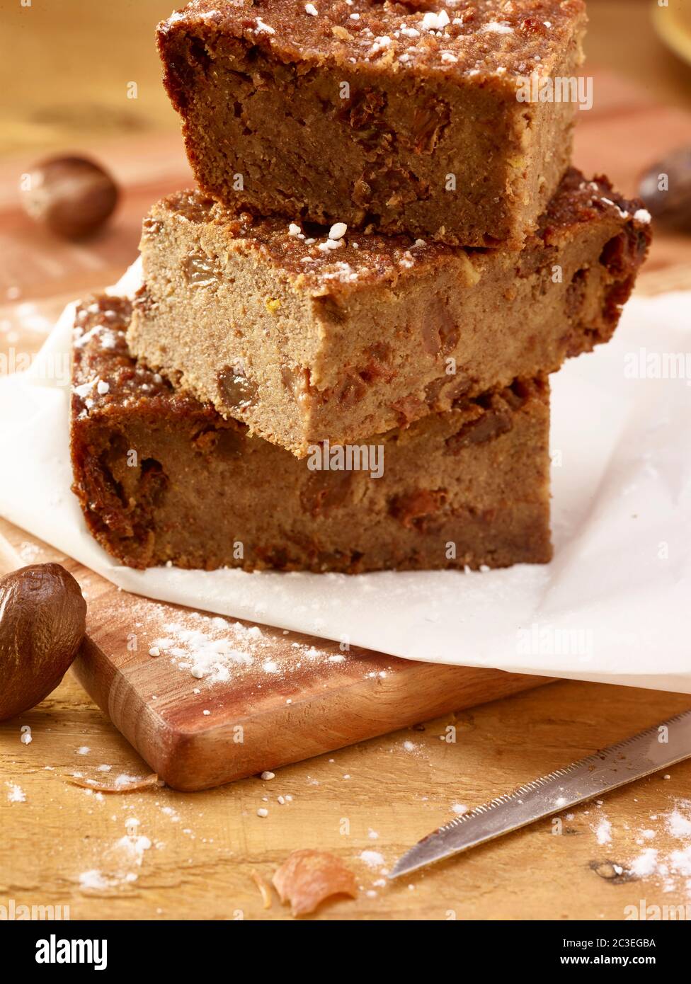 Sliced Bread Pudding on greaseproof paper waiting to be wrapped as a ...