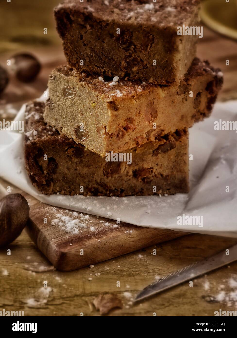 Sliced Bread Pudding on greaseproof paper waiting to be wrapped as a ...