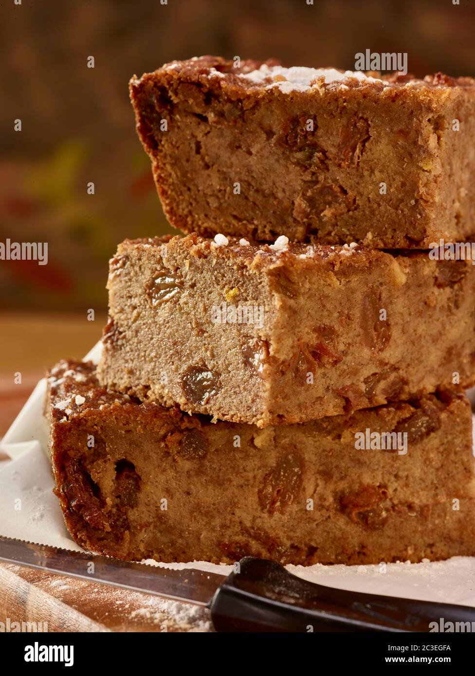 Sliced Bread Pudding on greaseproof paper waiting to be wrapped as a ...