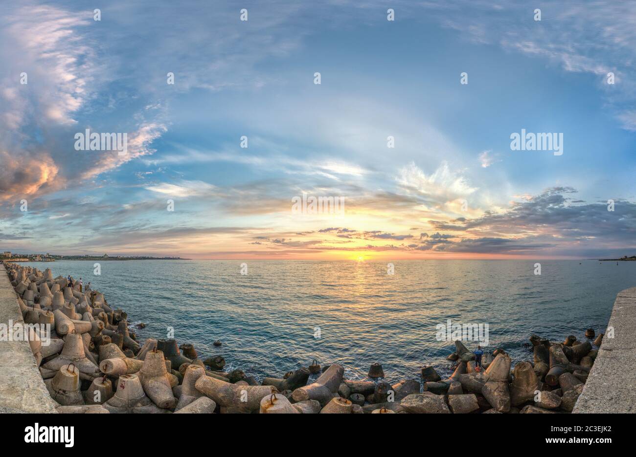The sea breakwater structure is densely located on the shore of the ...