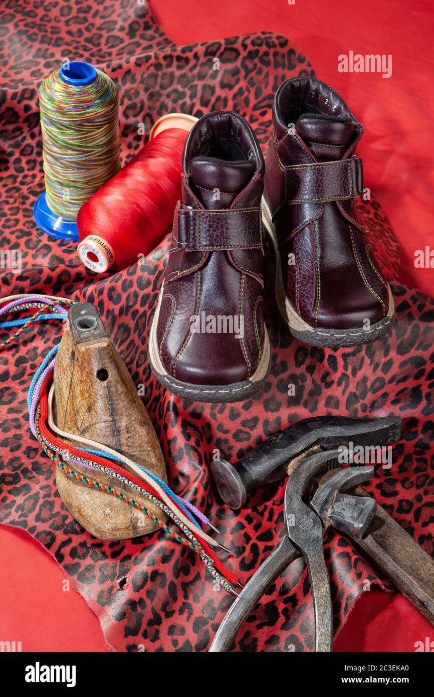 Still Life With Shoes And Tools Stock Photo - Alamy