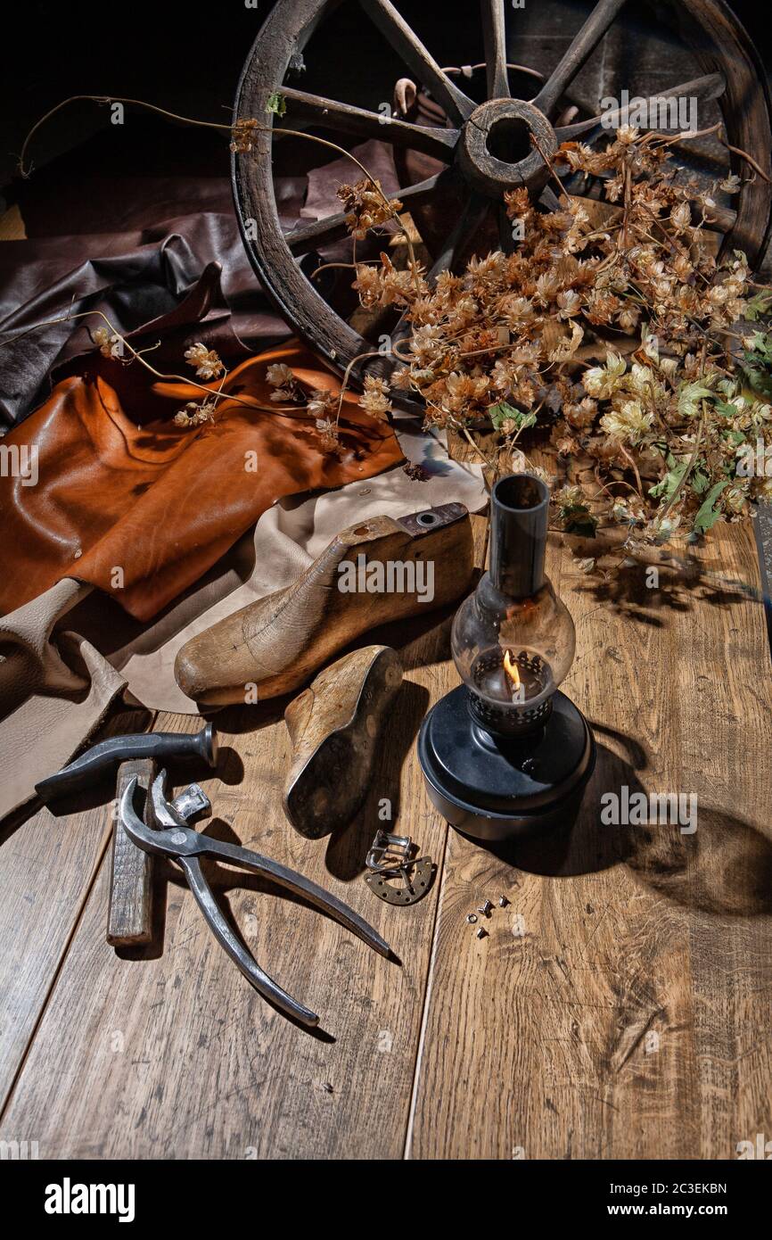 Still Life With Shoes And Tools Stock Photo - Alamy