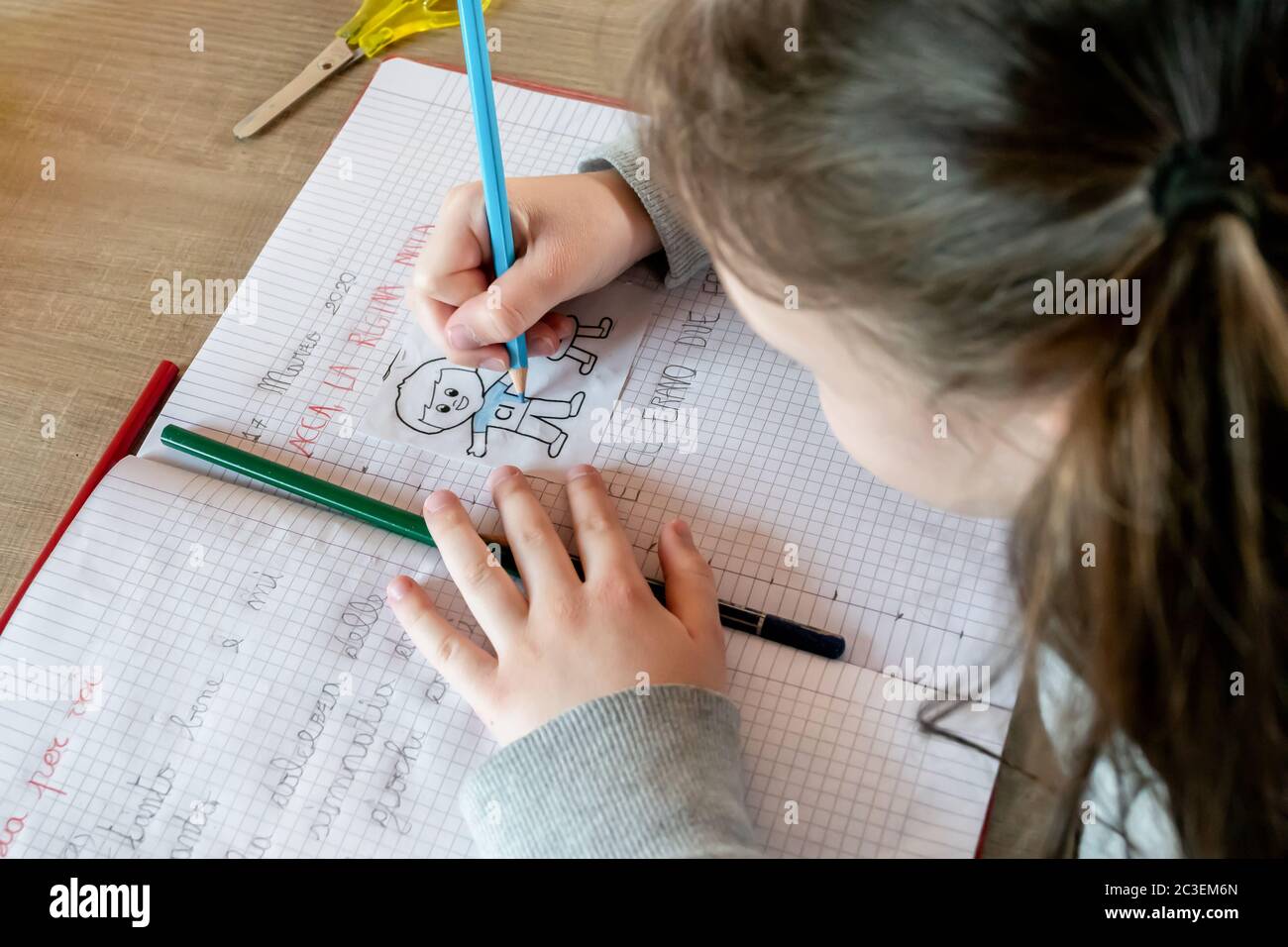 Little girl learning to write and color Stock Photo - Alamy