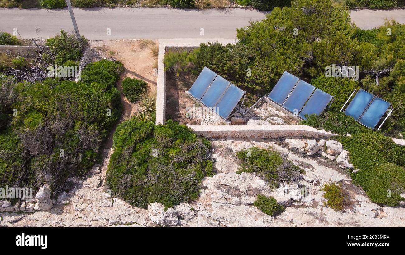 Aerial view of solar panels surrounded by typical vegetation of the ...