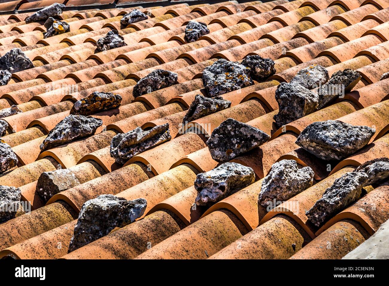 roof tiles with stones Stock Photo - Alamy