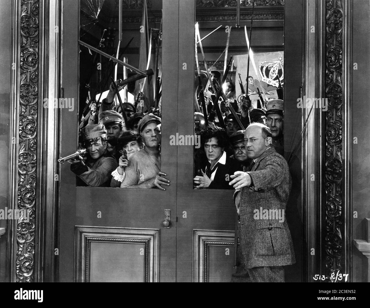 Director CECIL B. DeMILLE instructing Movie Extras for Revolution ...