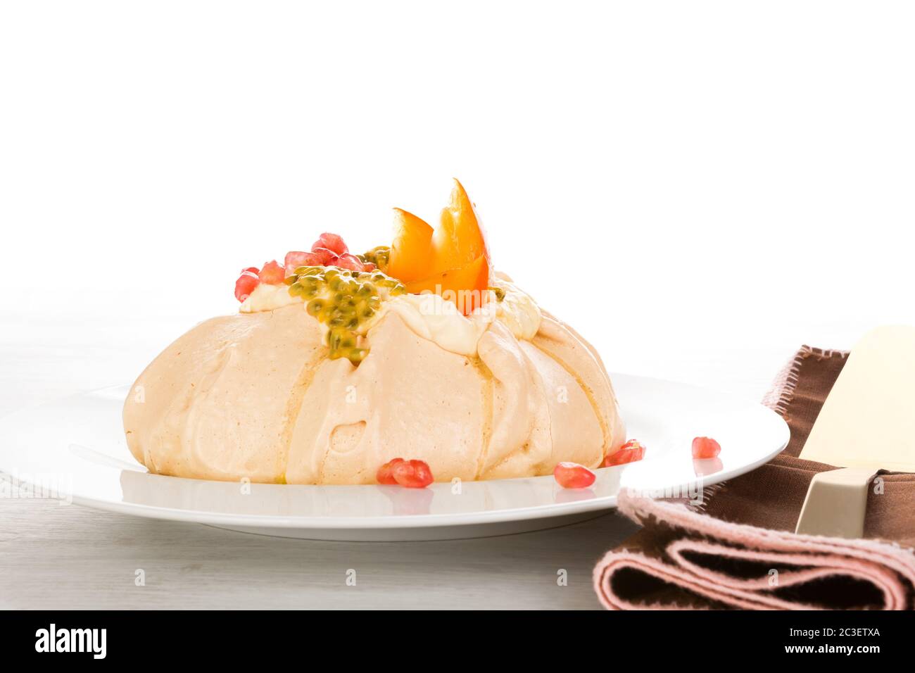 Gourmet Pavlova dessert with passion fruit and pomegranate Stock Photo ...