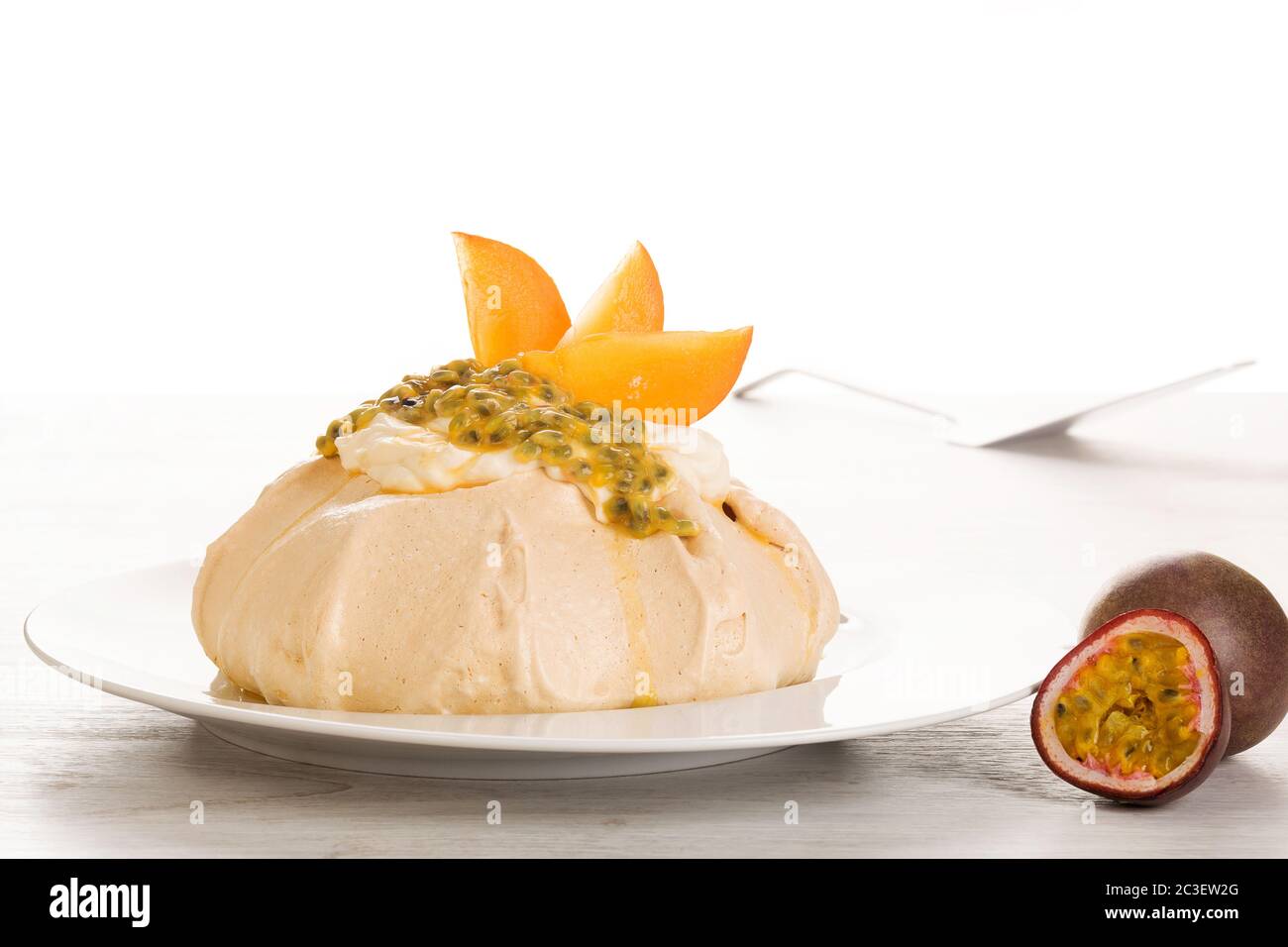 Gourmet Pavlova dessert with passion fruit Stock Photo - Alamy
