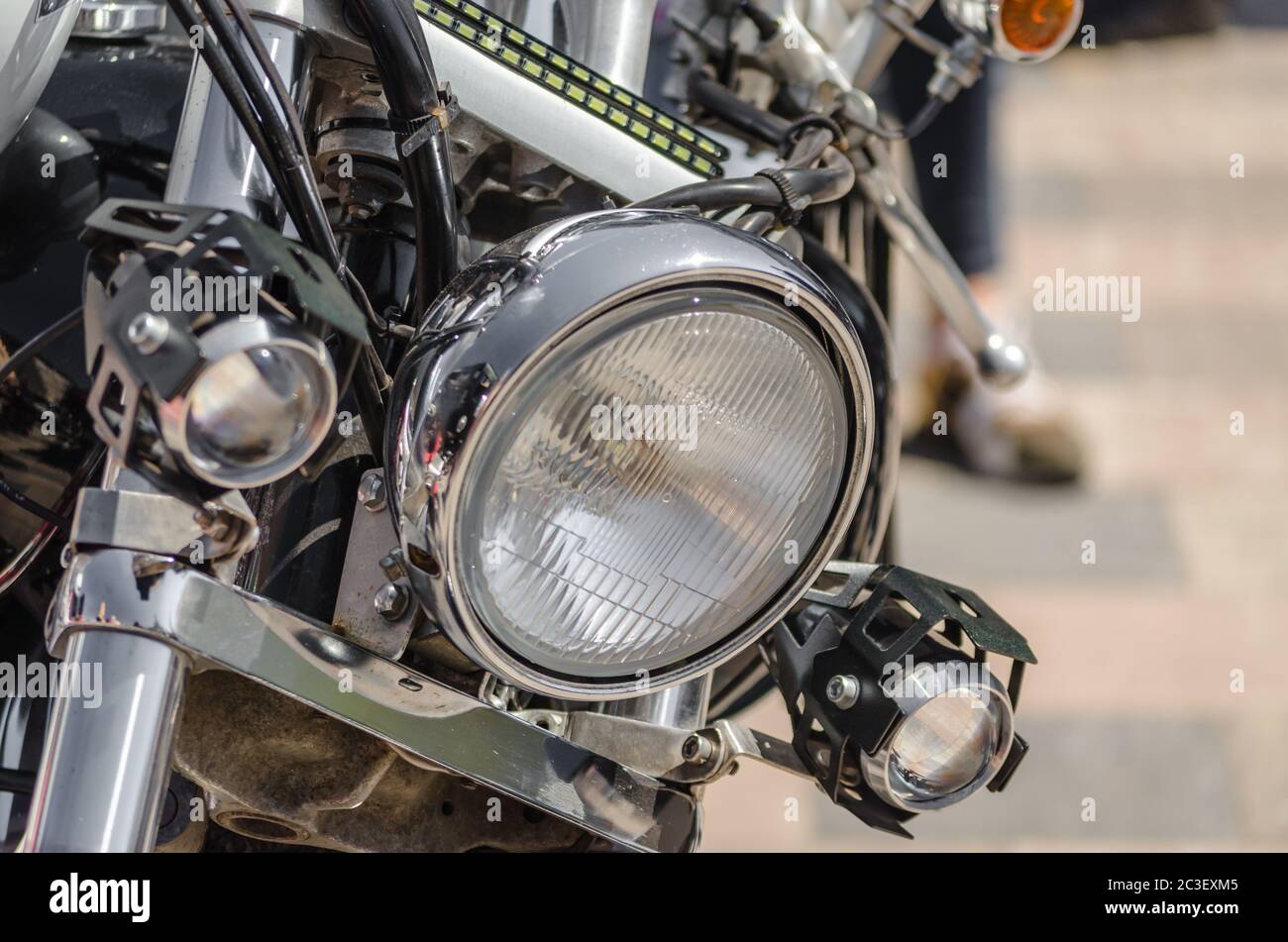 chrome shiny chopper motorcycle headlight close up Stock Photo - Alamy