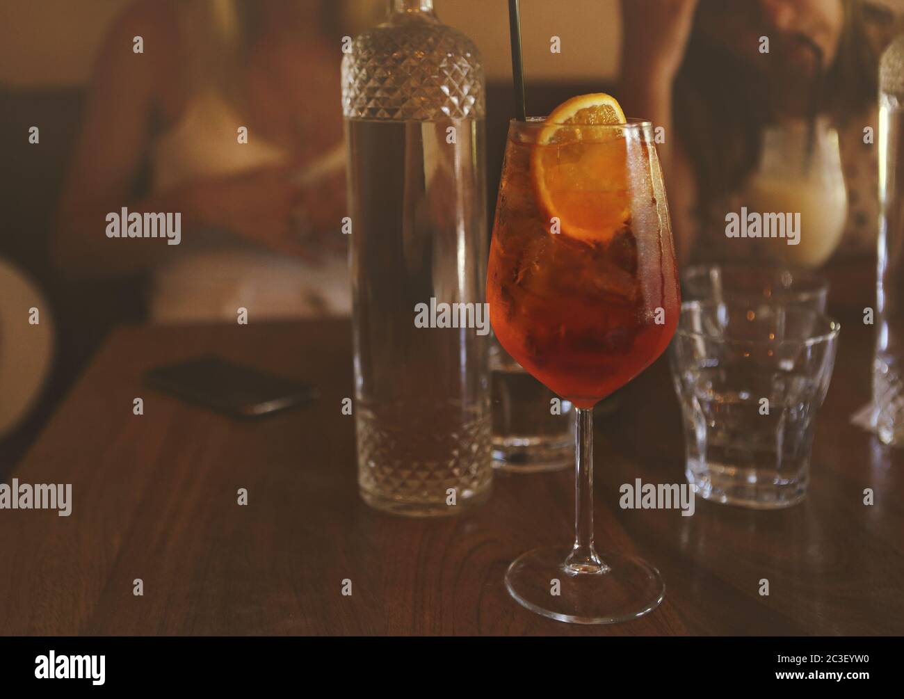 Glass of alcohol cocktail on table Stock Photo - Alamy