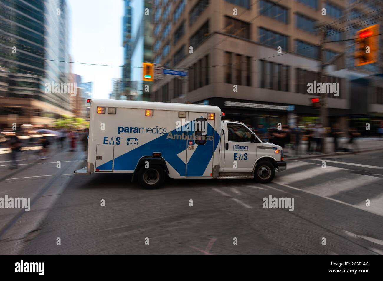 Toronto, Canada - June 19, 2020. A Toronto EMS ambulance navigates ...