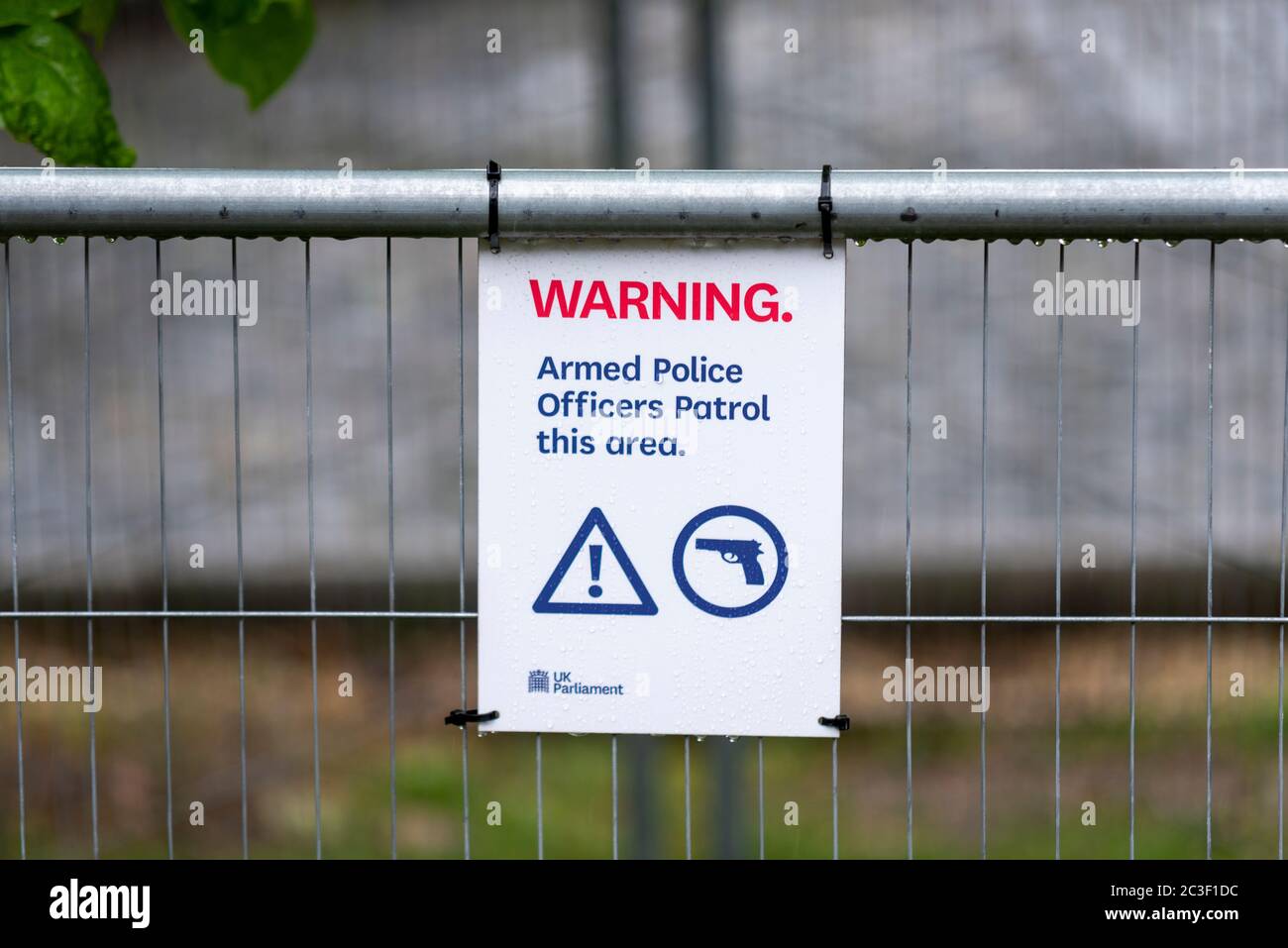 Sign inside grounds of Palace of Westminster warning of armed police ...