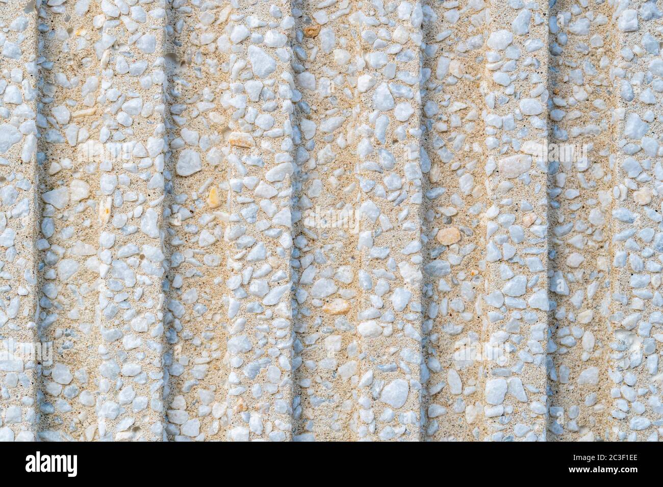 Decorative beige tile on the facade of the building as a background or ...