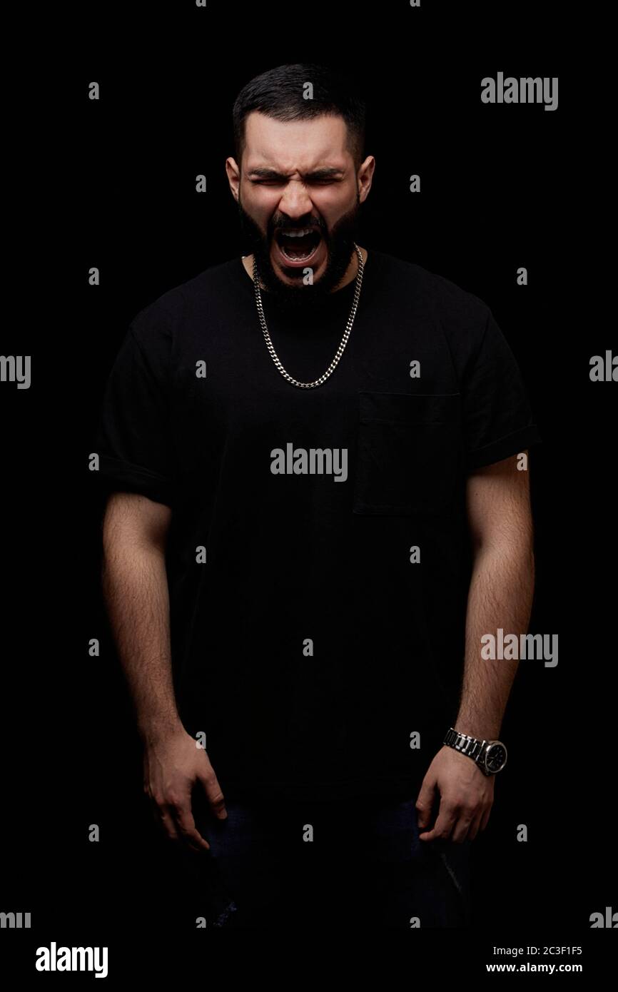 a dramatic portrait of a young serious guy Stock Photo - Alamy