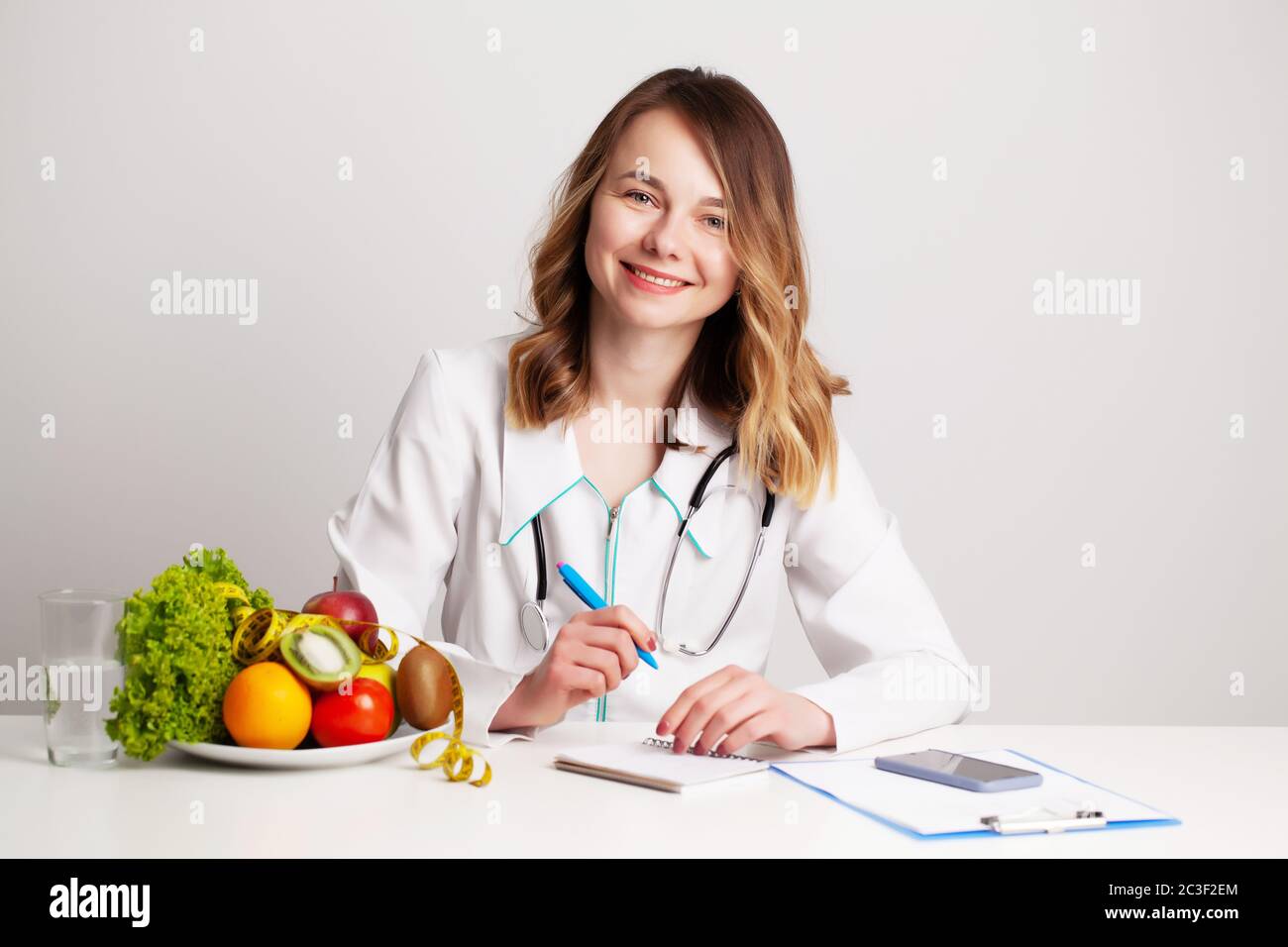 Nutritionist makes a diet plan for proper nutrition for the patient in ...