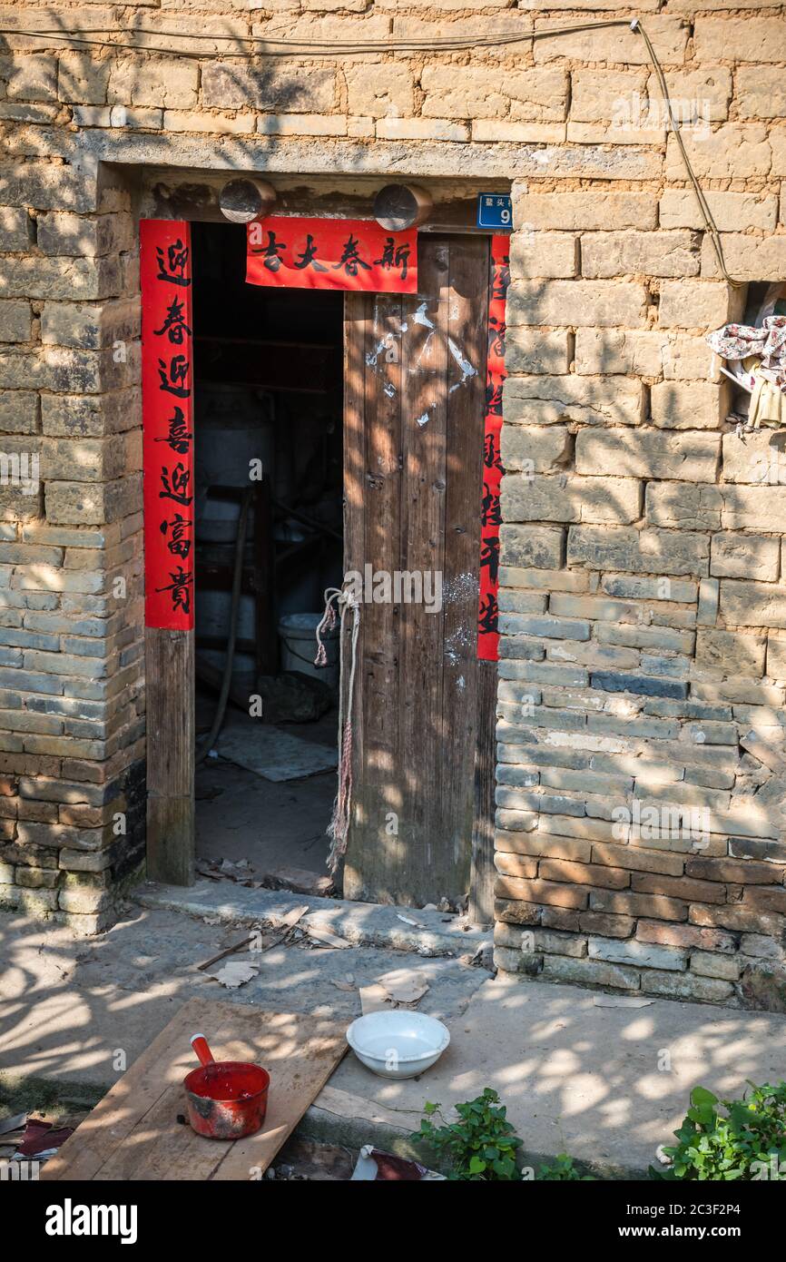 Chinese villager at door hi-res stock photography and images - Alamy