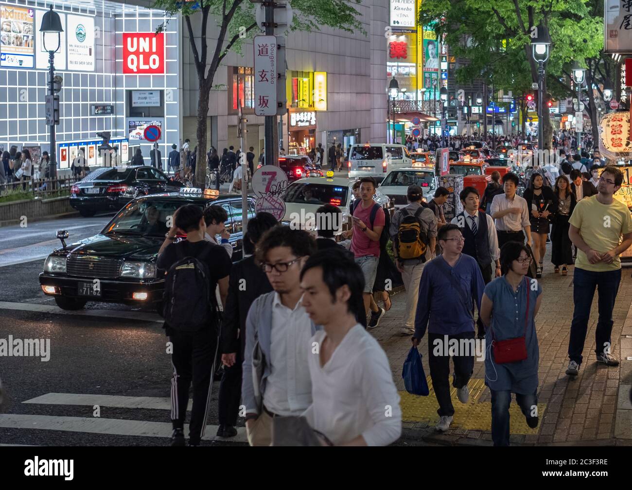 Pedestrian walking in Shibuya street a night, Tokyo, Japan Stock Photo ...