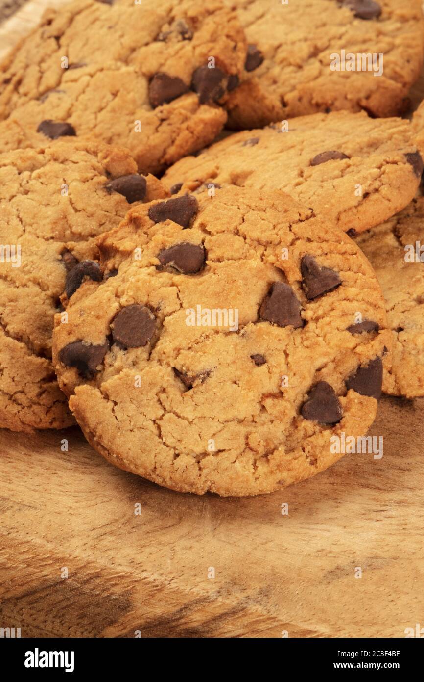 Chocolate chip cookies close-up on a rustic wooden background with a ...