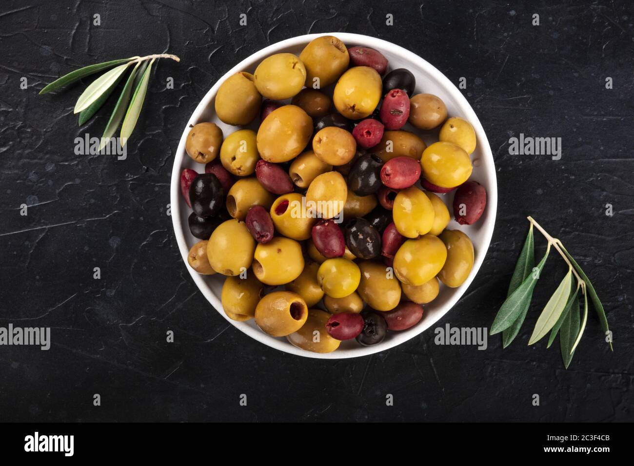 Olives variety. Black, green and red olives, shot from the top on a ...