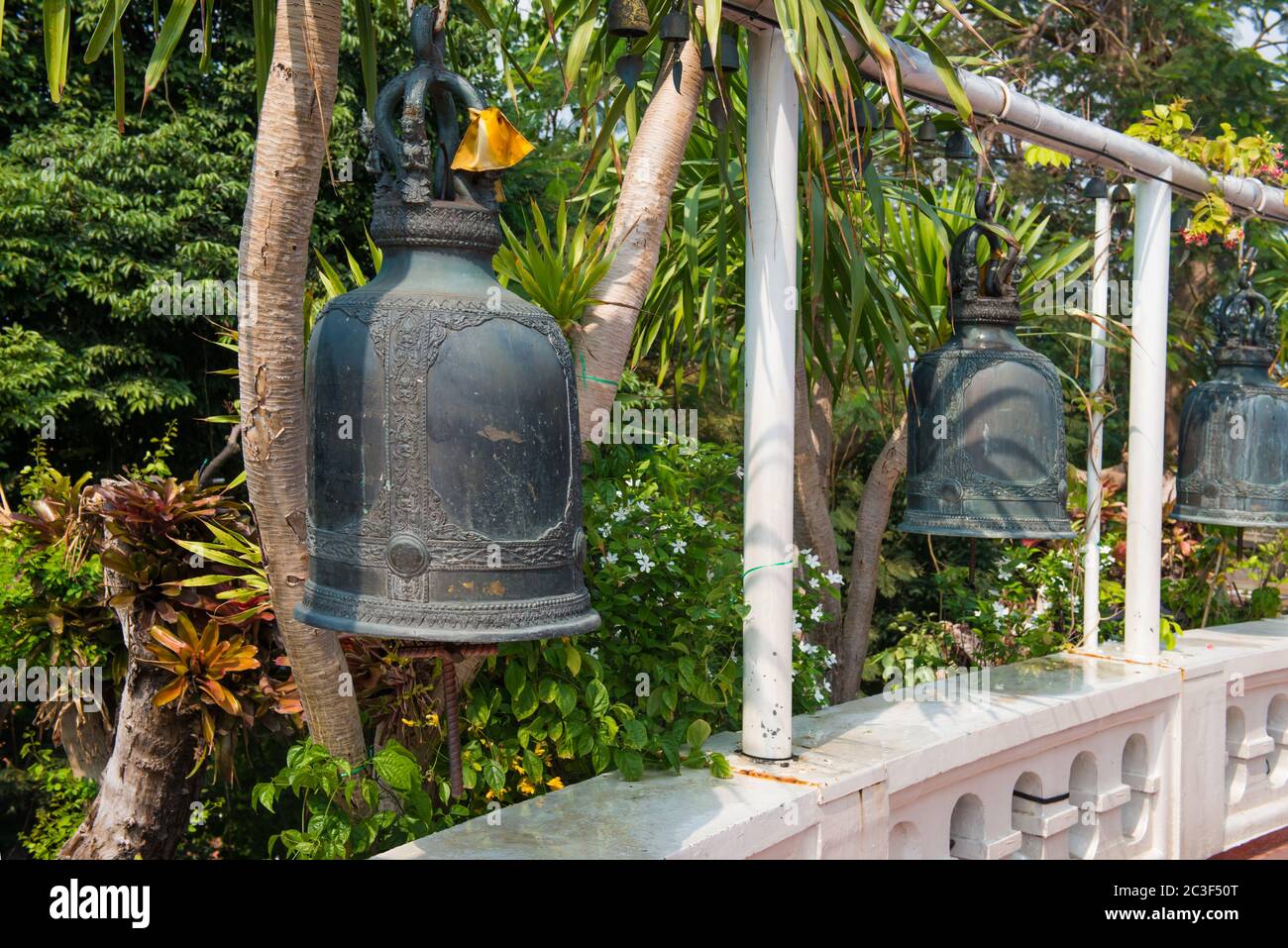 Row of large traditional bells hanging in buddhist temple Stock Photo ...
