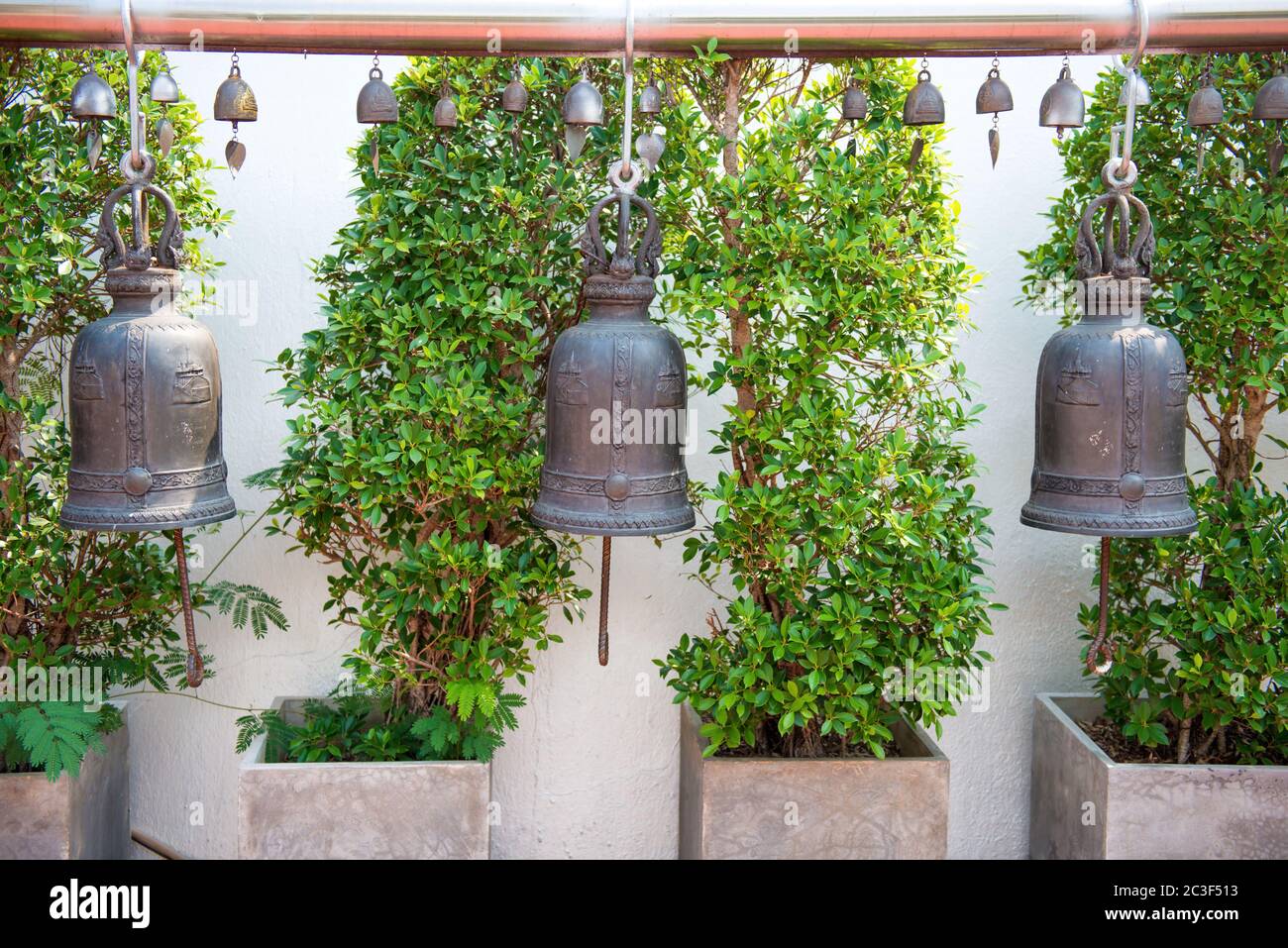 Row of large traditional bells hanging in buddhist temple Stock Photo ...