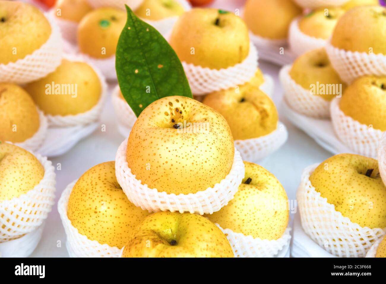 Stacks of apples packed in baskets at food market Stock Photo - Alamy