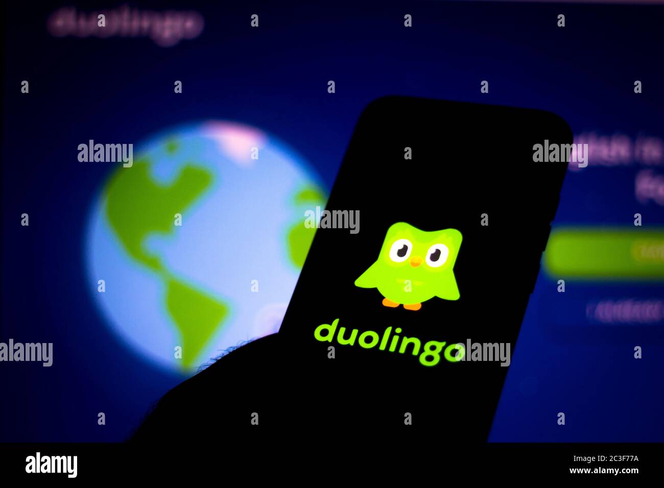 In this photo illustration the Duolingo logo seen displayed on a ...