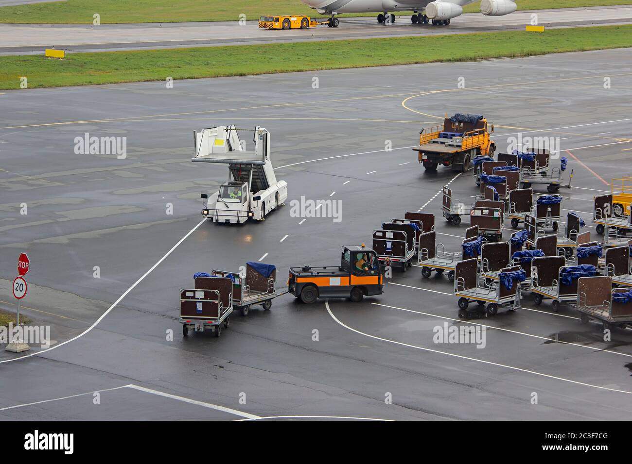 Airport movable ramp. Car ramps driving across the airfield Stock Photo ...