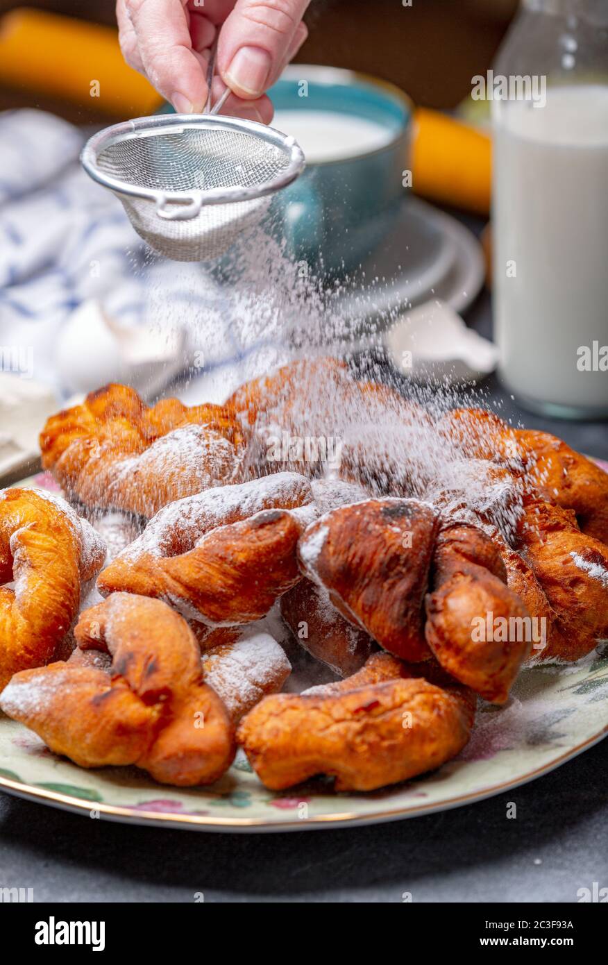 Traditional doughnuts with powdered sugar Stock Photo - Alamy