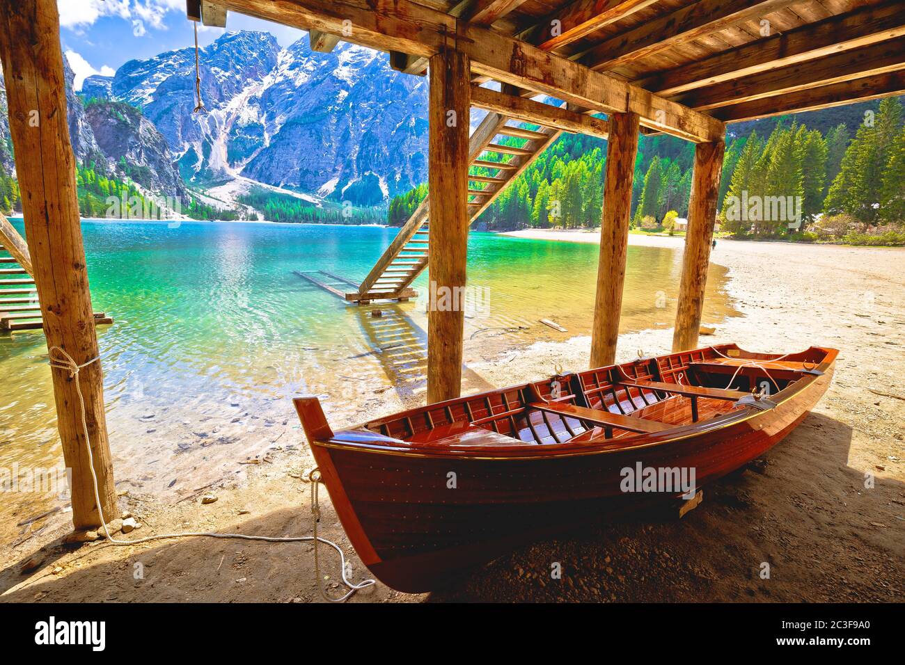 Wooden boat under boats house on Braies lake in alpine landscape Stock ...