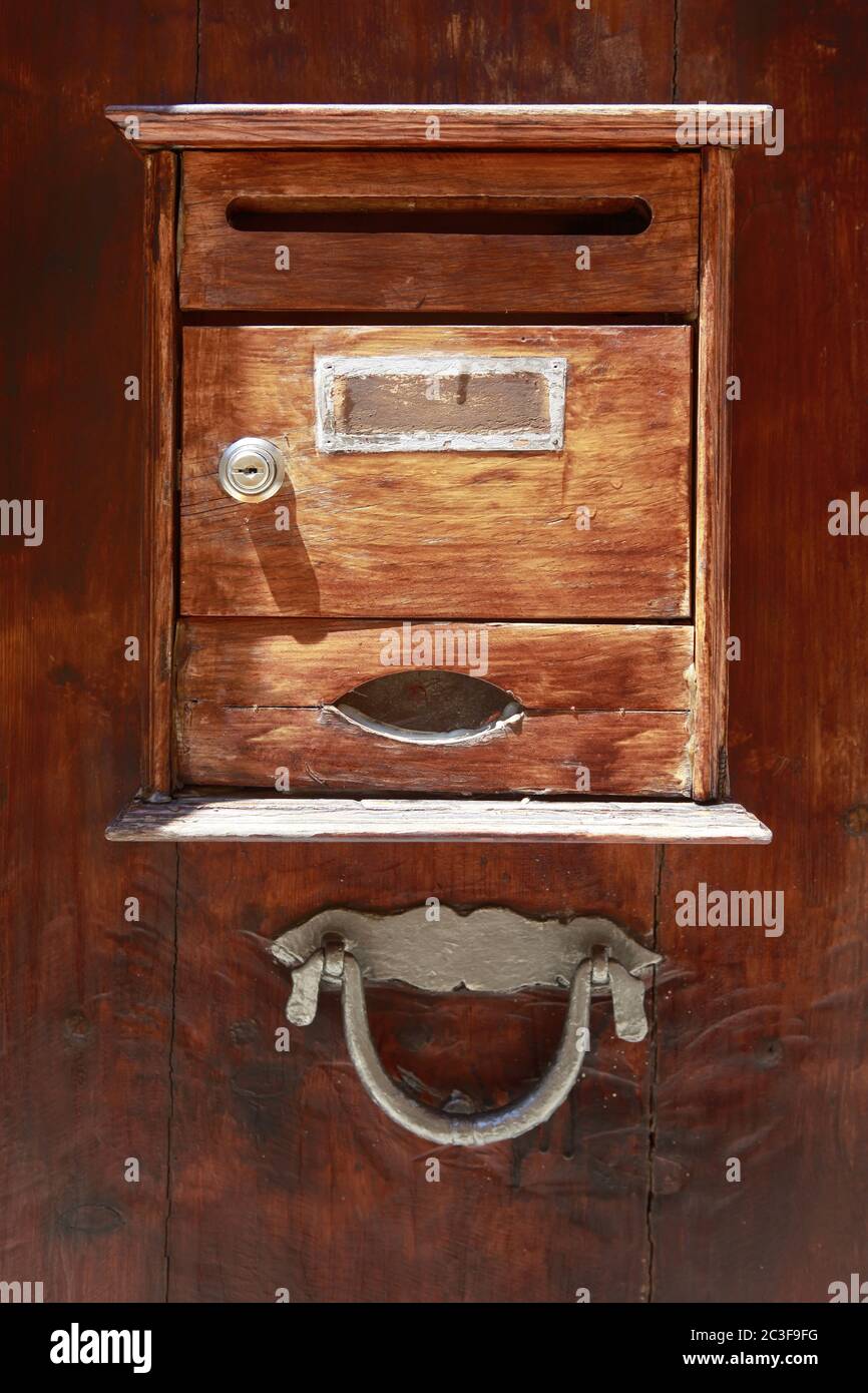 vintage wooden mailbox on a wooden door Stock Photo - Alamy