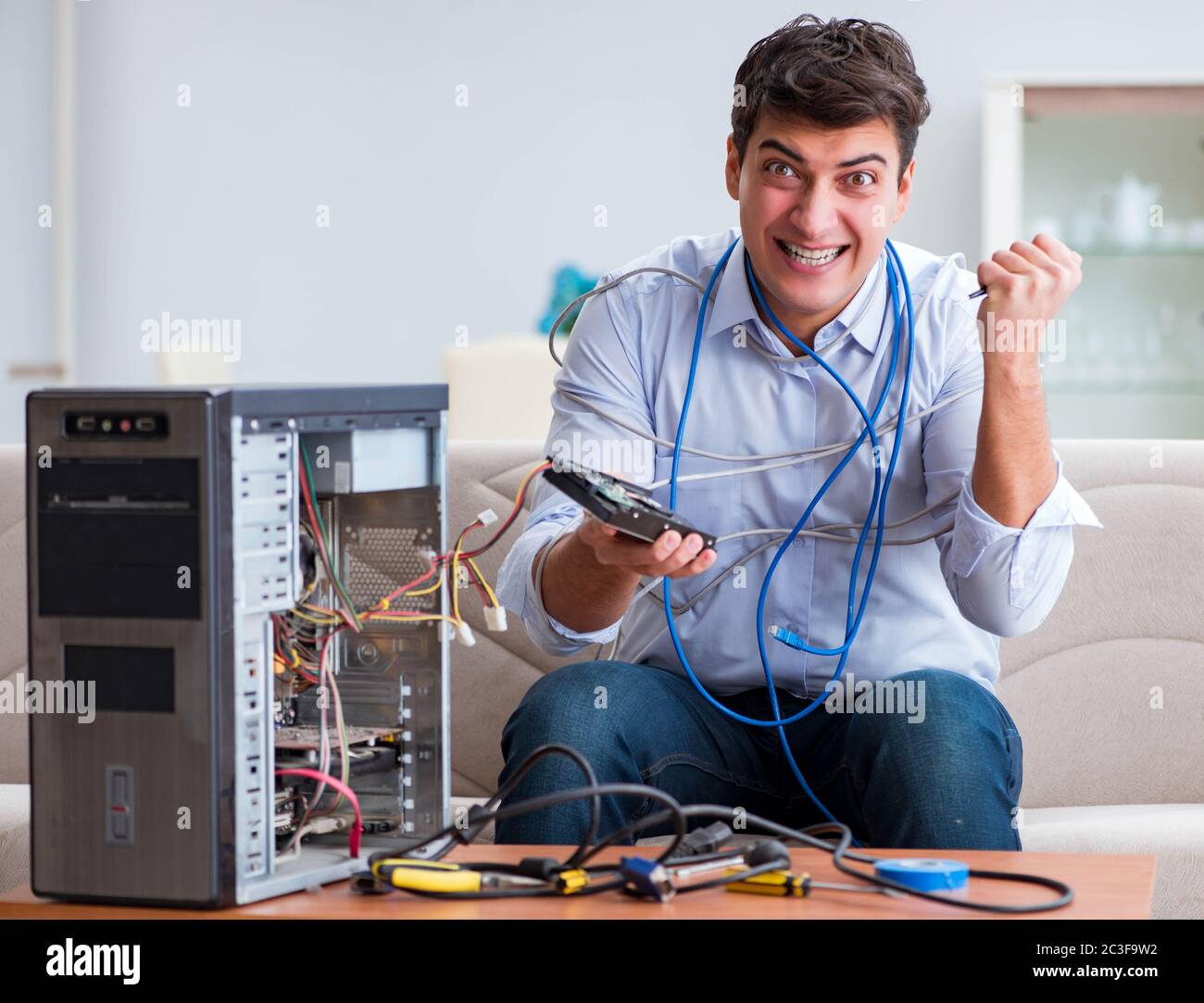Frustrated man with broken pc computer Stock Photo - Alamy