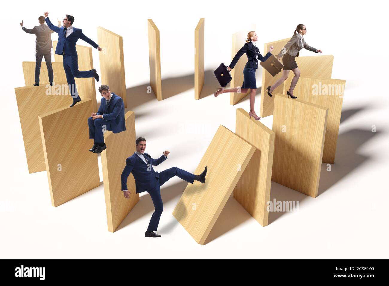 Domino effect and competition concept Stock Photo - Alamy