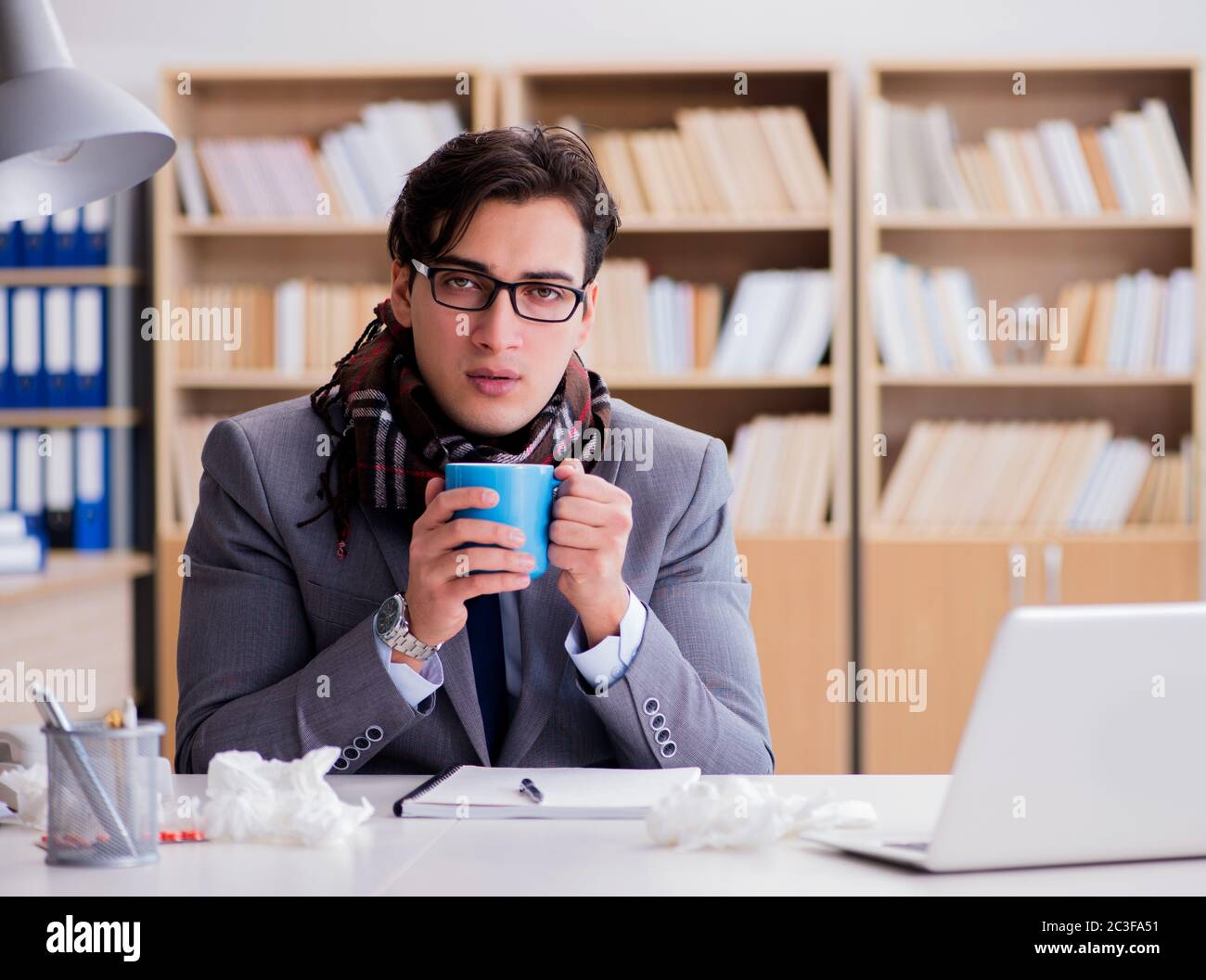 Sick businessman suffering from illness in the office Stock Photo - Alamy