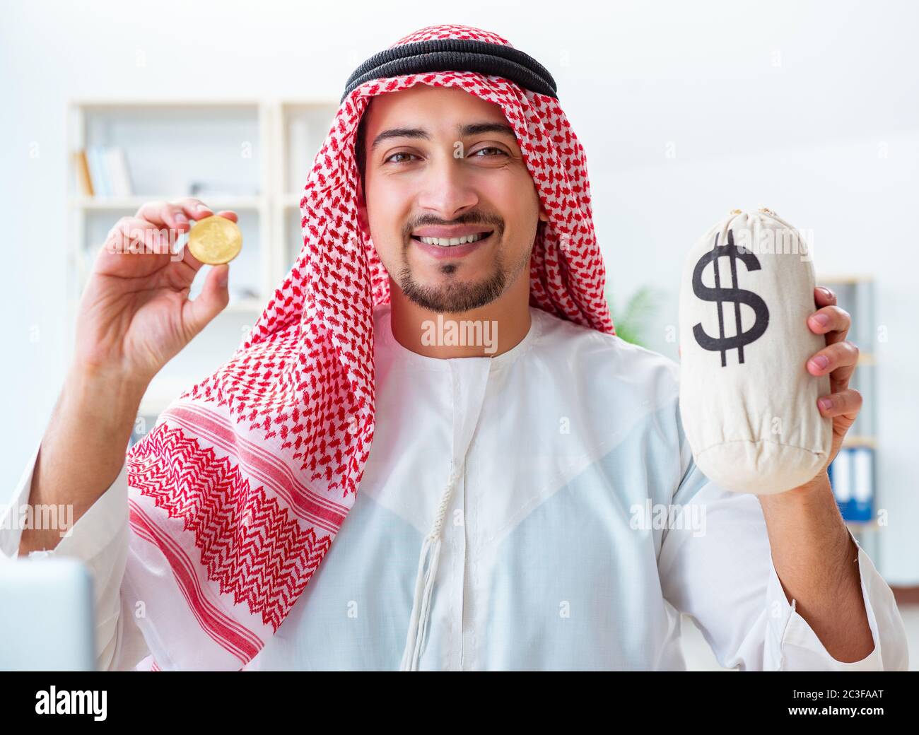 Arab man with bitcoin in cryptocurrency mining concept Stock Photo - Alamy