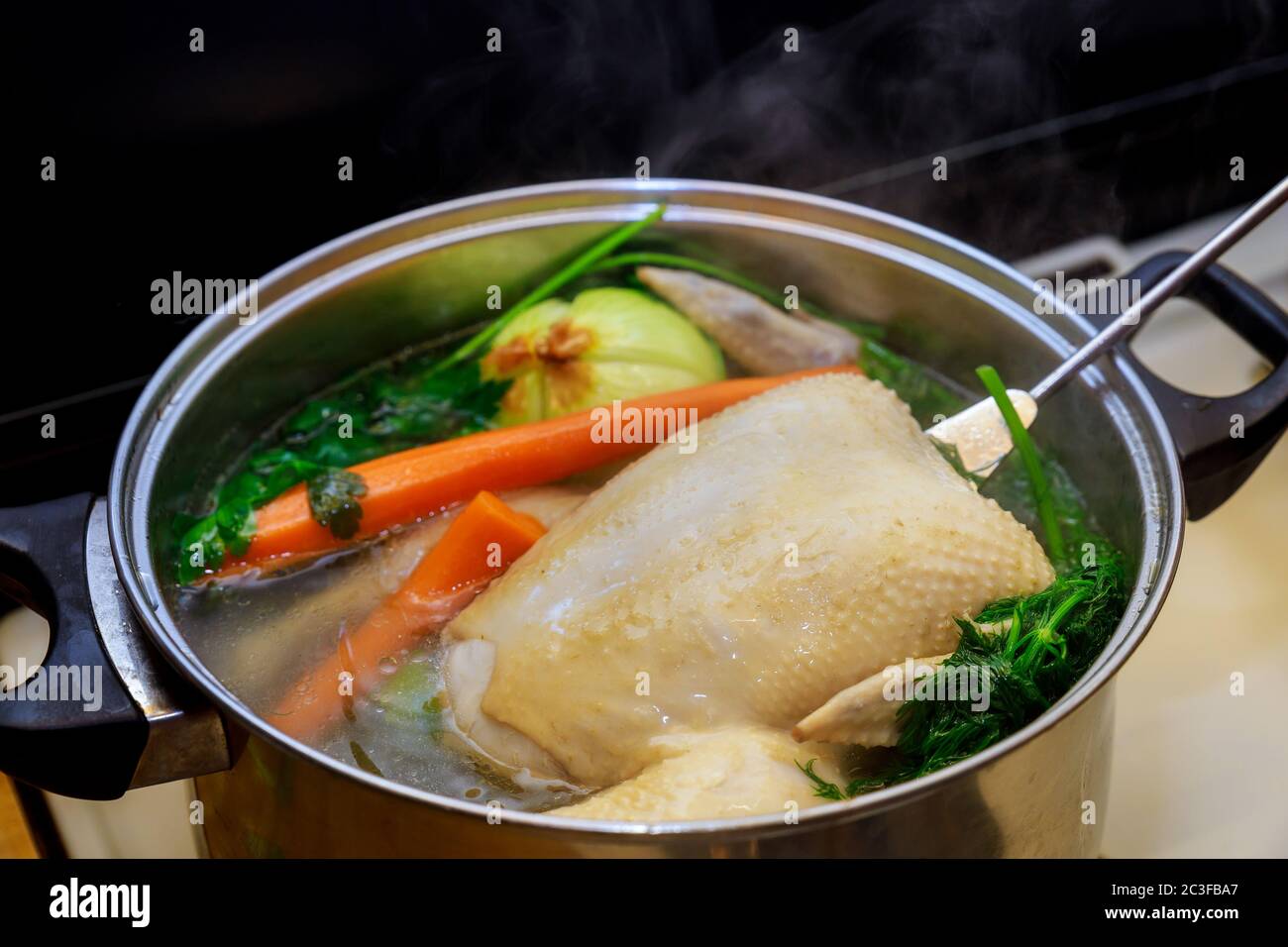 Boiling vegetables on stove hi-res stock photography and images - Alamy
