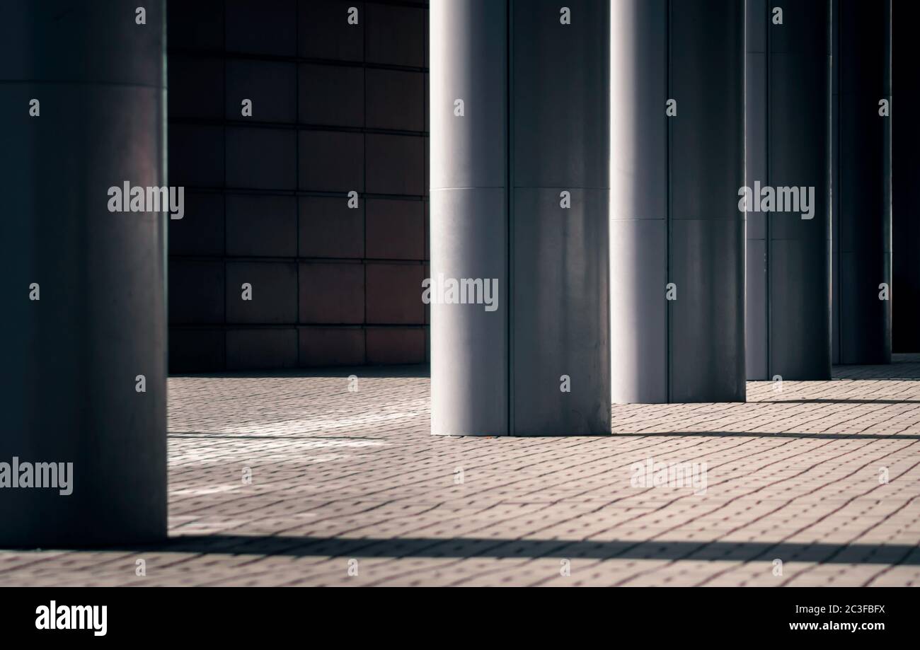columns of a modern building on a city street without people Stock ...