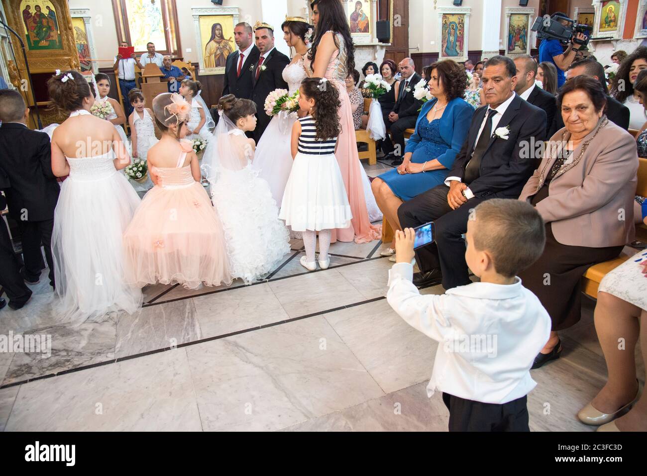The Rev. Androwas Bahus officiates a wedding of some of his ...