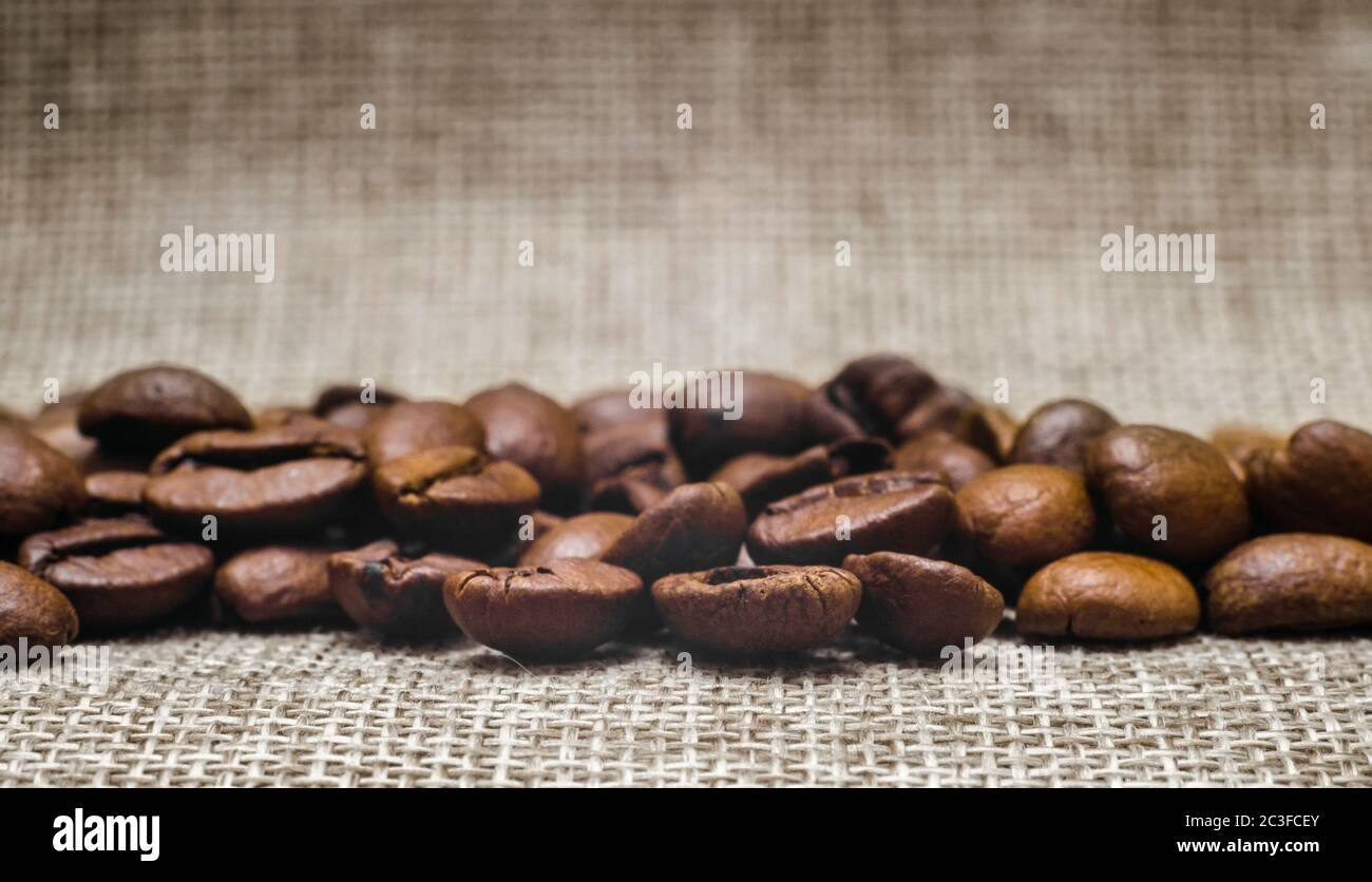 many coffee beans on a matting macro Stock Photo - Alamy
