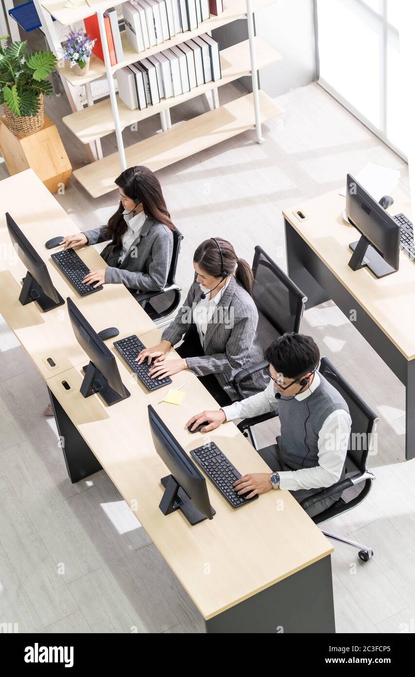 Call center team working top view Stock Photo - Alamy