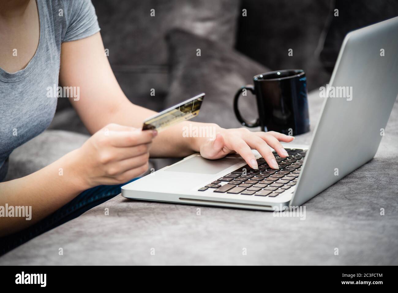 Woman holding credit card hi-res stock photography and images - Alamy
