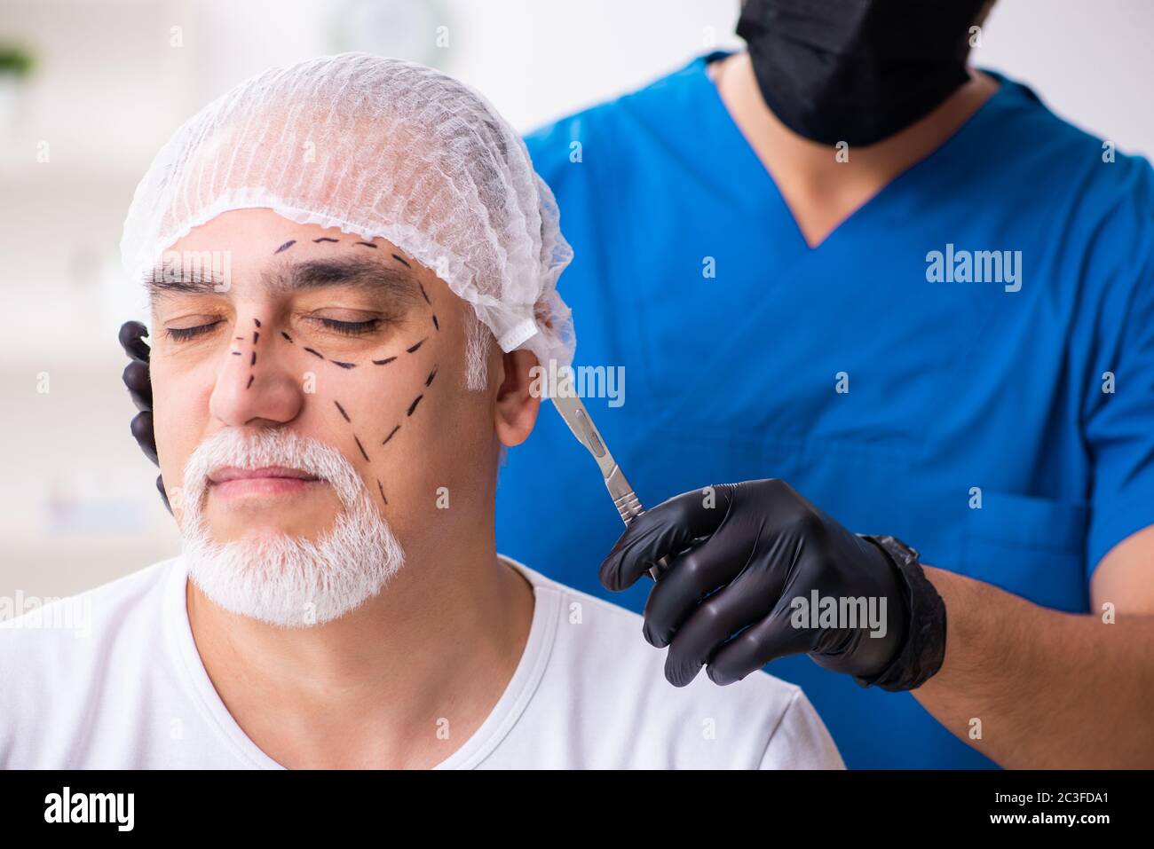 Old man visiting male doctor for plastic surgery Stock Photo - Alamy