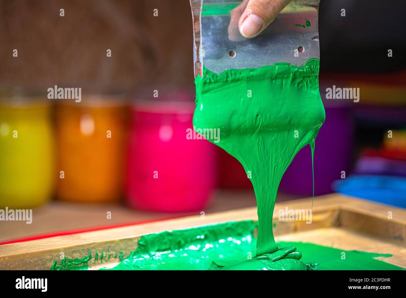 Green paint dripping from paint brush hi-res stock photography and ...