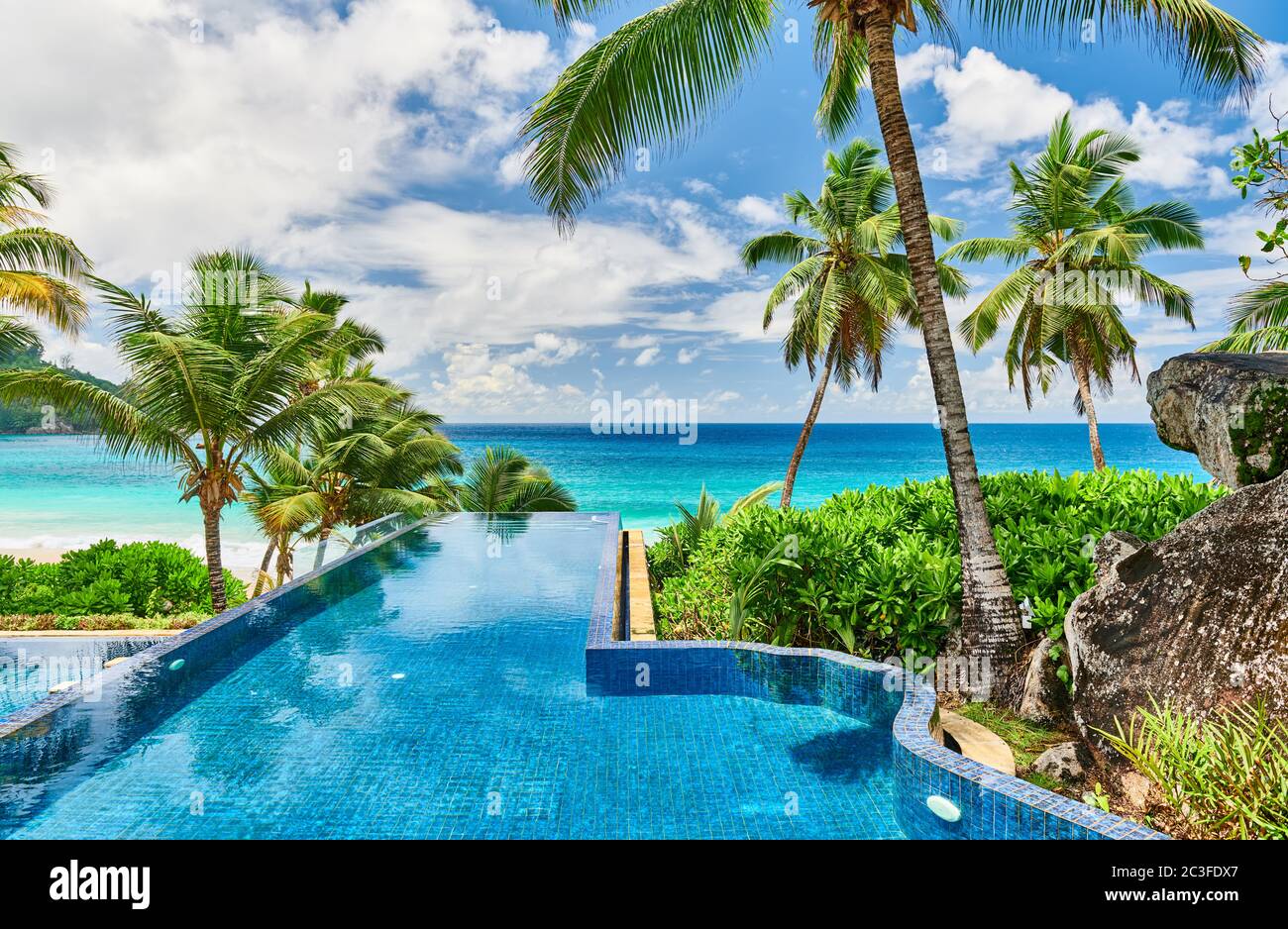 Beach with resort swimming pool at Seychelles Stock Photo - Alamy