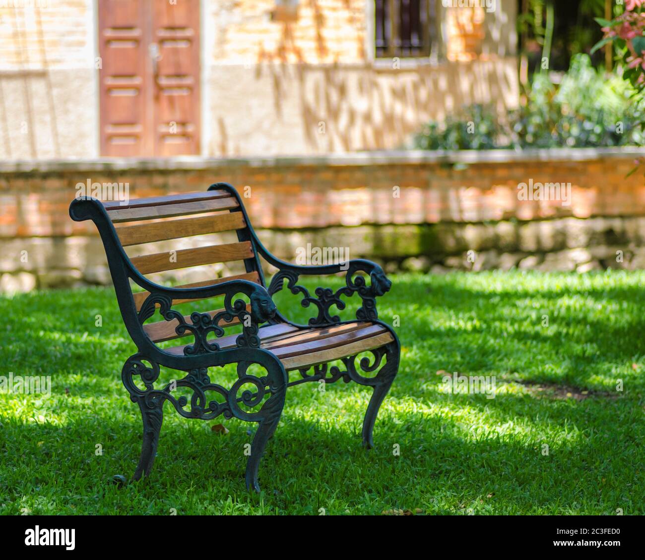 A quite bench in the backyard Stock Photo - Alamy